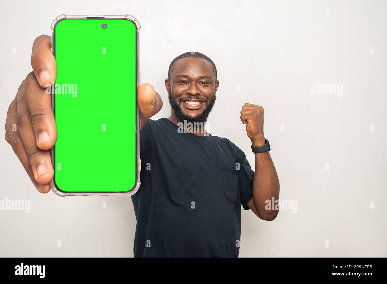 black man showing his phone screen Stock Photo - Alamy