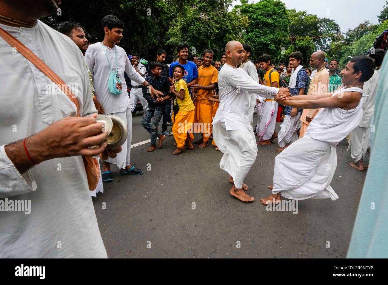 Hindu devotees dance during the Rath Yatra, or chariot festival ...