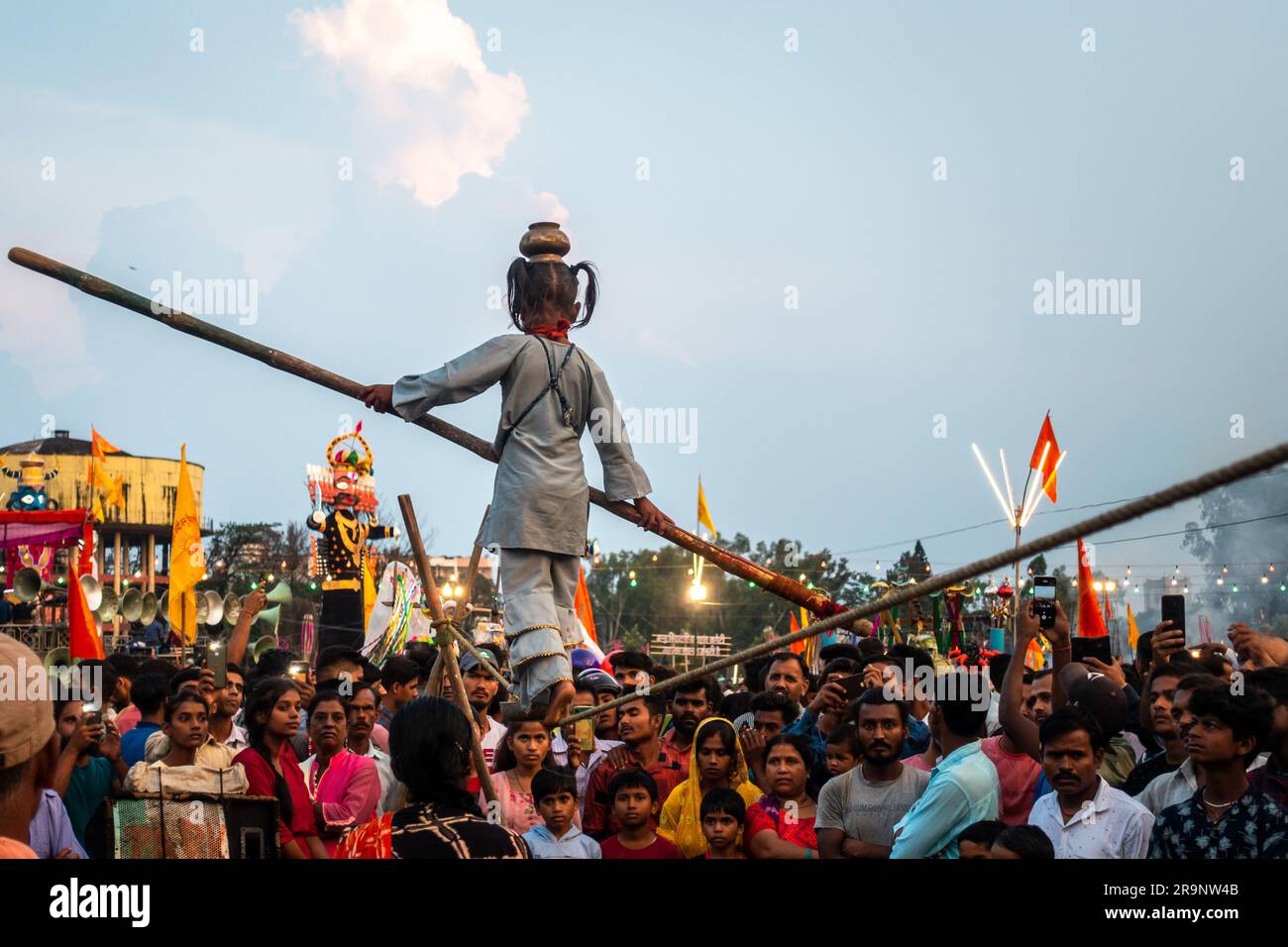 October 19th 2022, Dehradun, Uttarakhand, India. A small girl performing rope walk with a ...