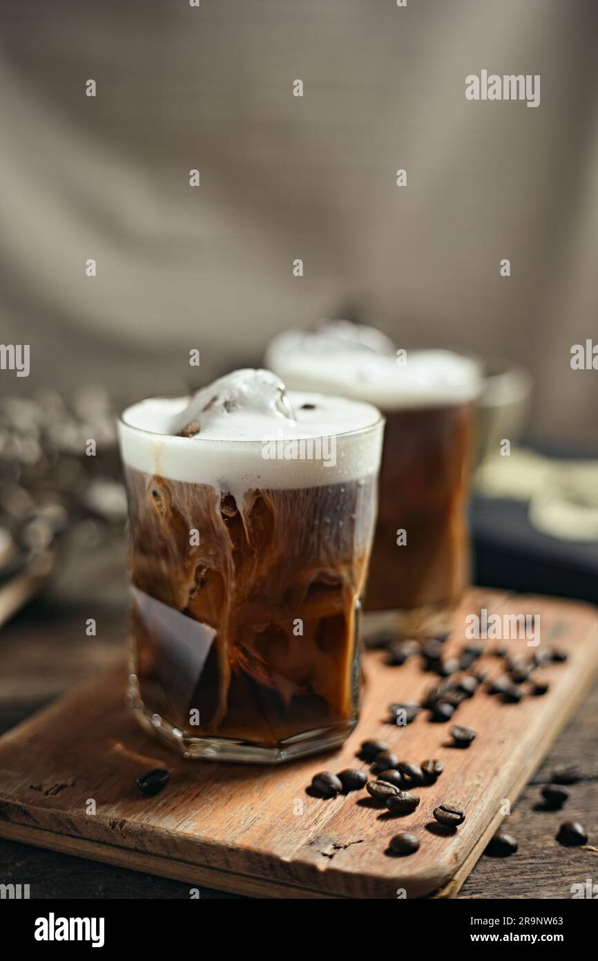 Iced Americano with milk foam, selective focus Stock Photo - Alamy