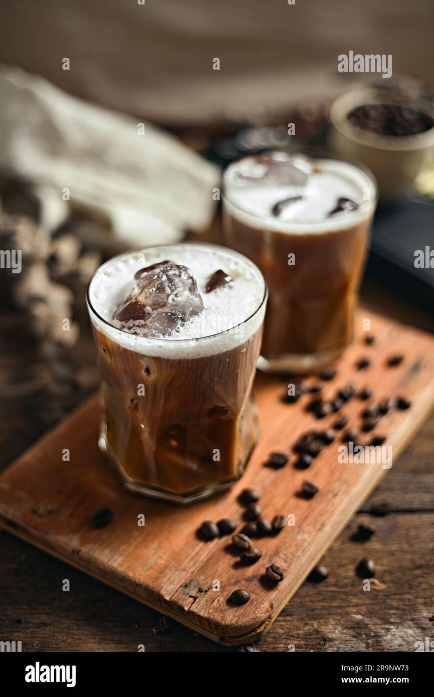Iced Americano with milk foam, selective focus Stock Photo - Alamy
