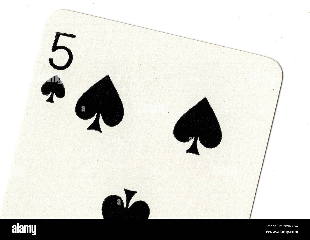 A vintage five of spades playing card on a white background Stock Photo ...