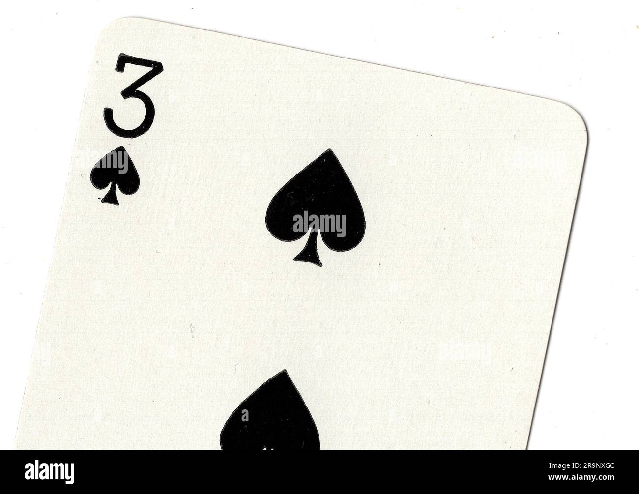 A vintage three of spades playing card on a white background Stock ...