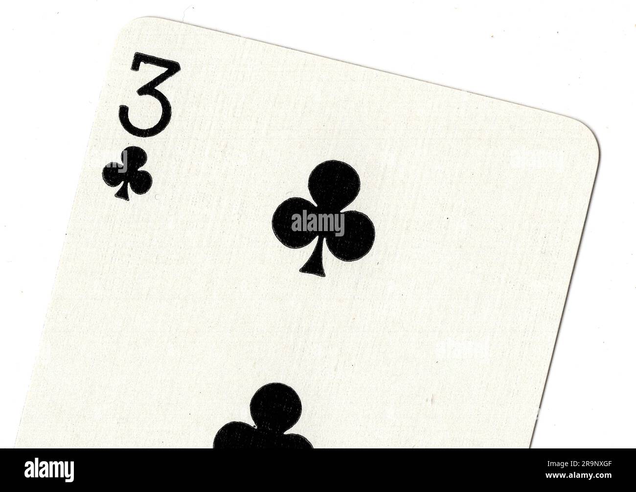 A vintage three of clubs playing card on a white background Stock Photo ...