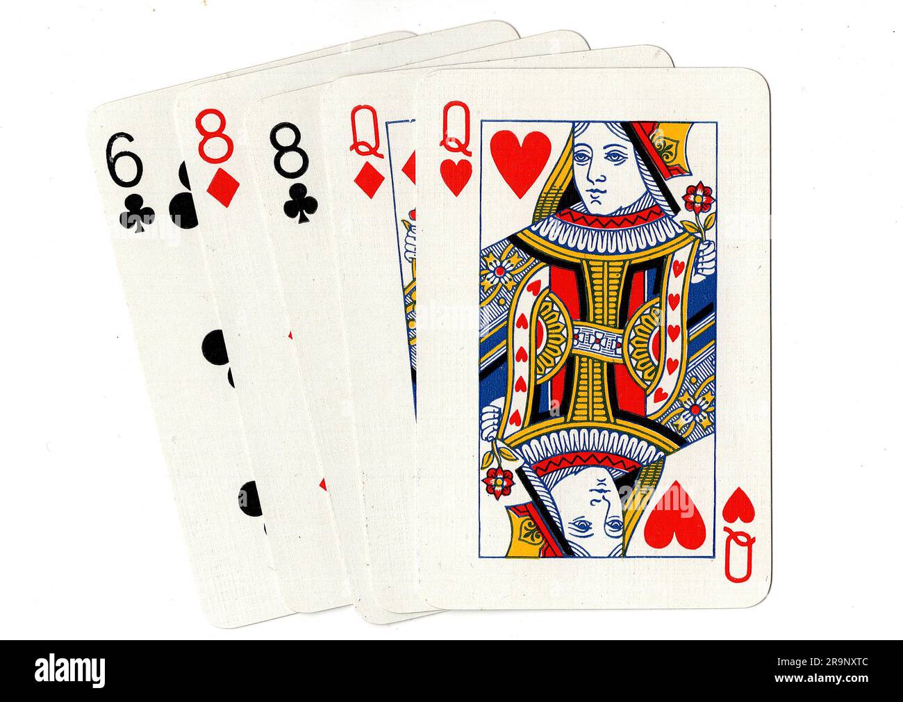 Playing cards in a poker hand showing two pairs of queens and eights on ...