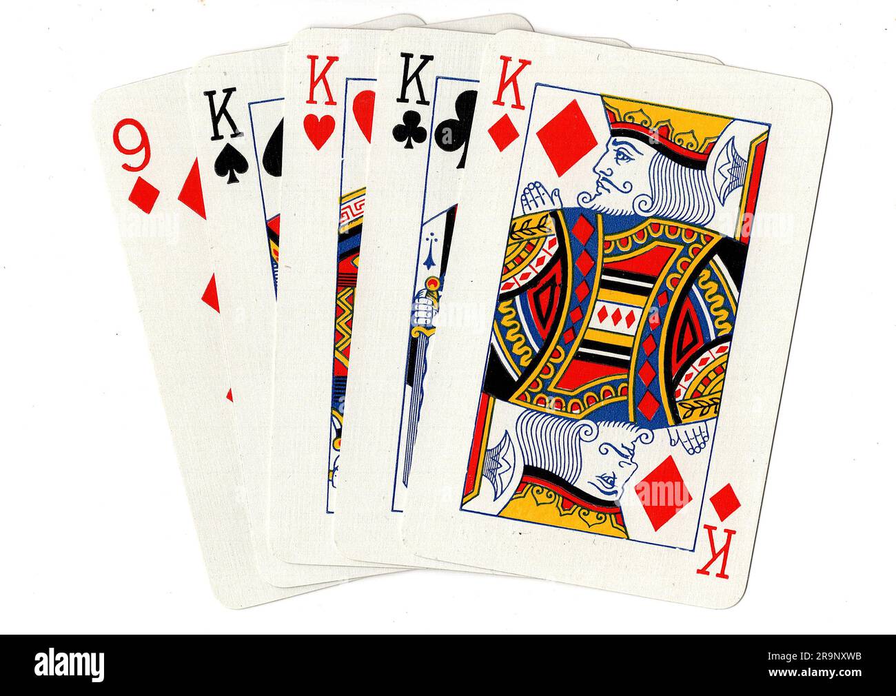 Playing cards in a poker hand showing four kings on a white background ...