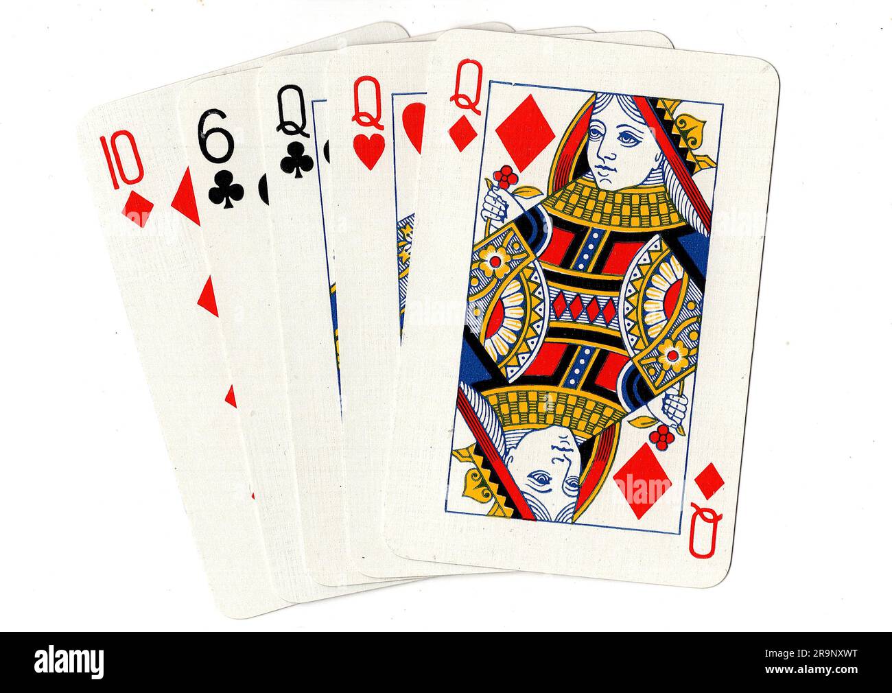 Playing cards in a poker hand showing three queens on a white ...