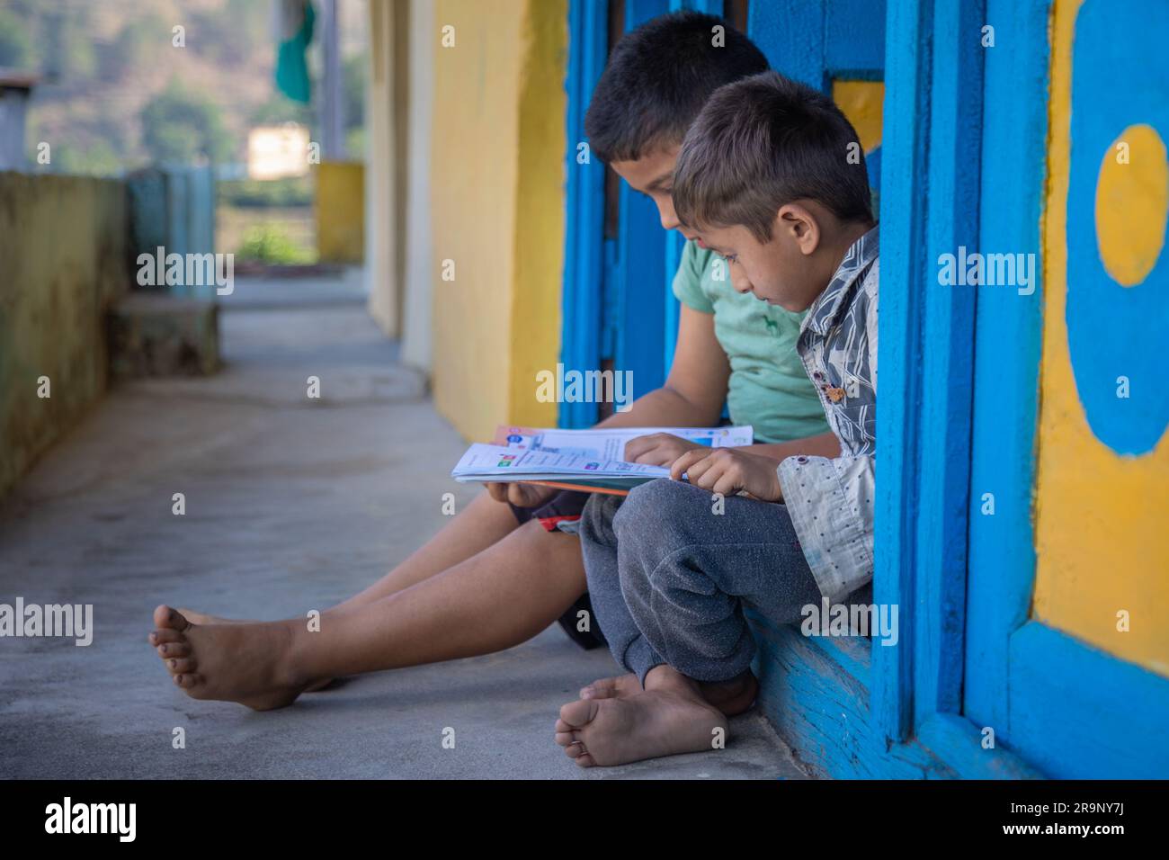 Indian rural boy reading book hi-res stock photography and images - Alamy
