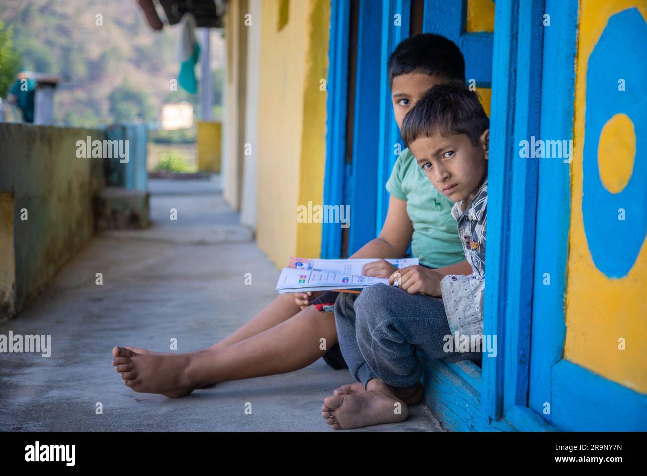 Indian kids reading book together rural village. concept of education ...