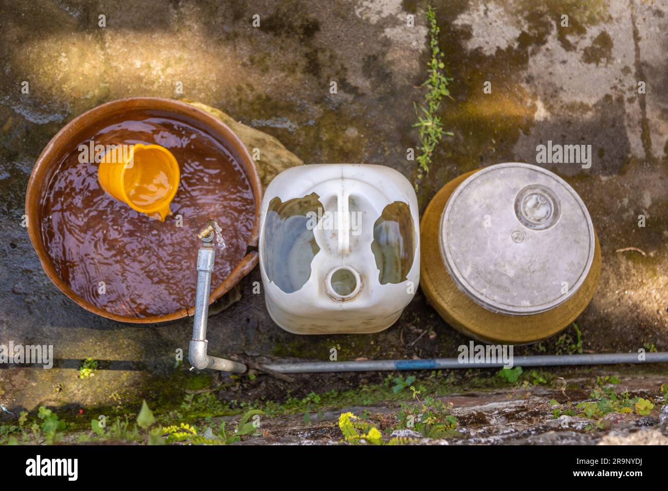 Clean pots waiting for streamline flow of water from tap Stock Photo ...
