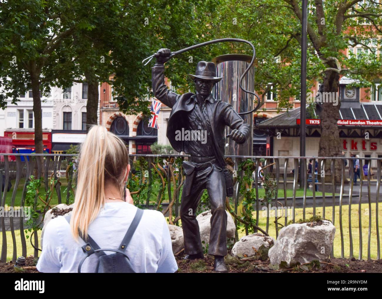 London, England, UK. 28th June, 2023. A passer-by takes photos of the ...