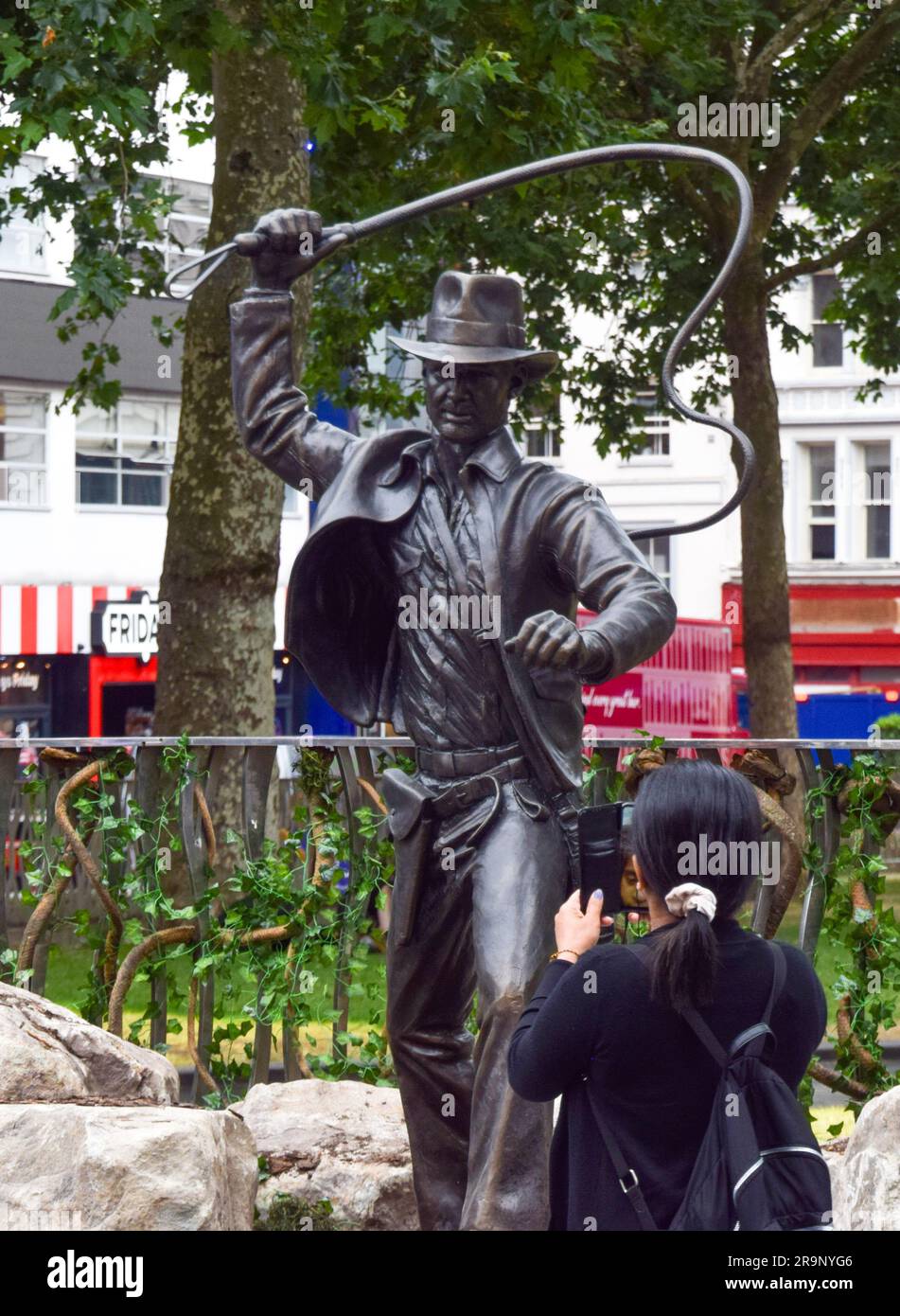 London, England, UK. 28th June, 2023. A passer-by takes photos of the ...