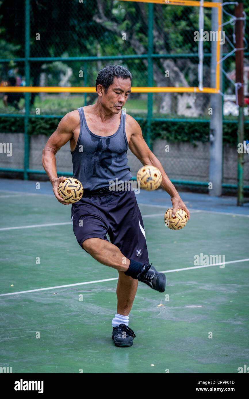 Bangkok, Thailand. 25th June, 2023. A Thai player of Sepak Takraw is ...