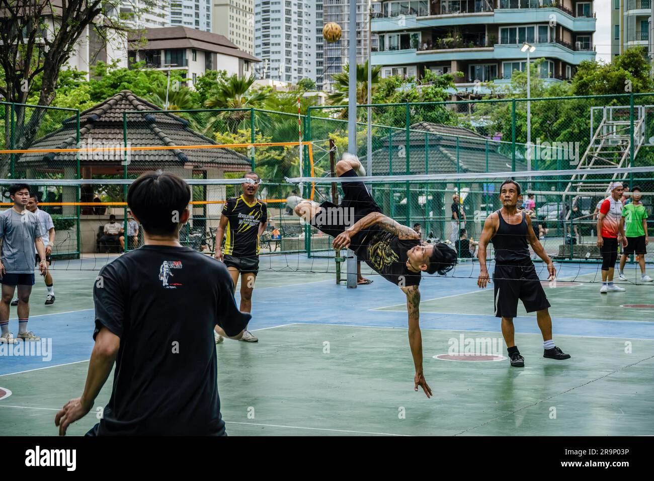 A Thai player of Sepak Takraw is seen performing an acrobatic figure ...