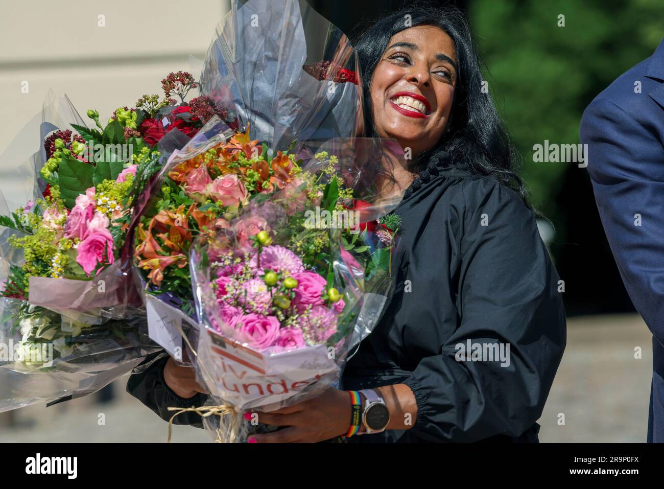 Politician Lubna Jaffery holds flowers after she was appointed Norway's ...