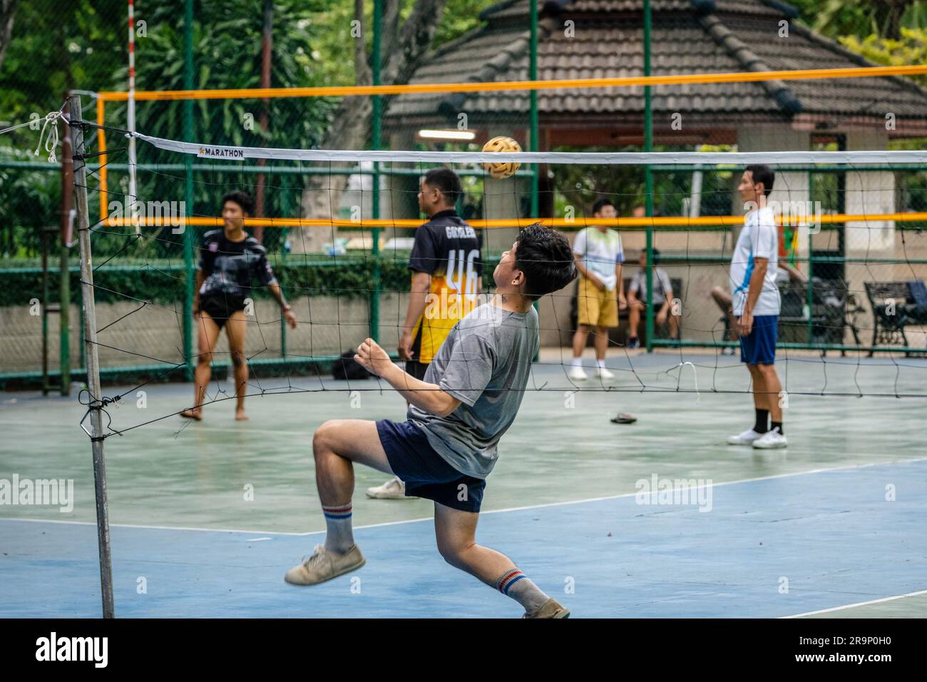 Bangkok, Thailand. 25th June, 2023. Local residents are seen playing Sepak Takraw at Benchasiri ...