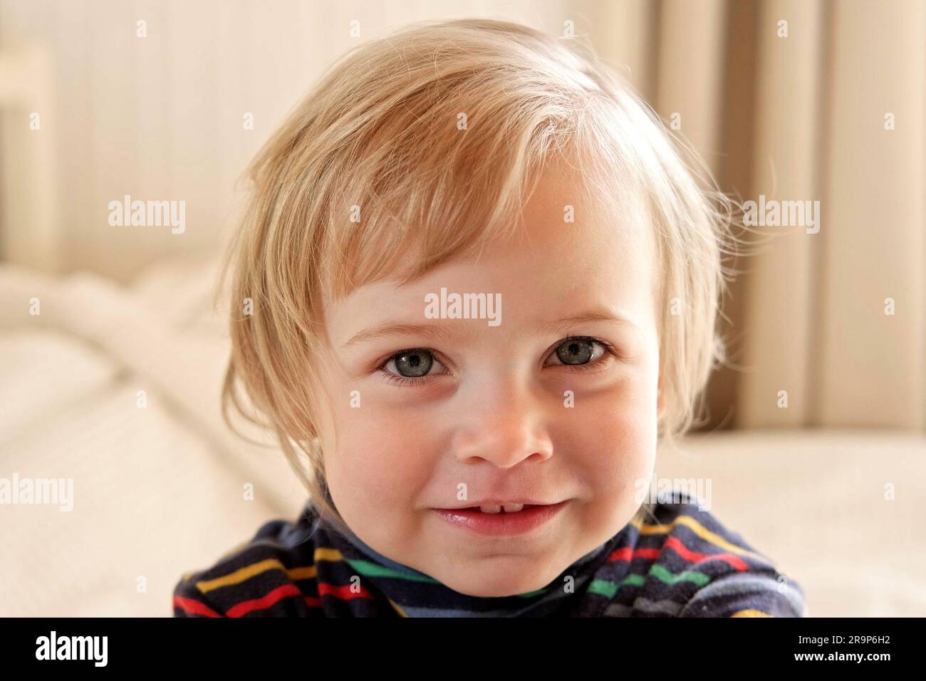 One little baby girl happy expression closeup face. Authentic real life ...