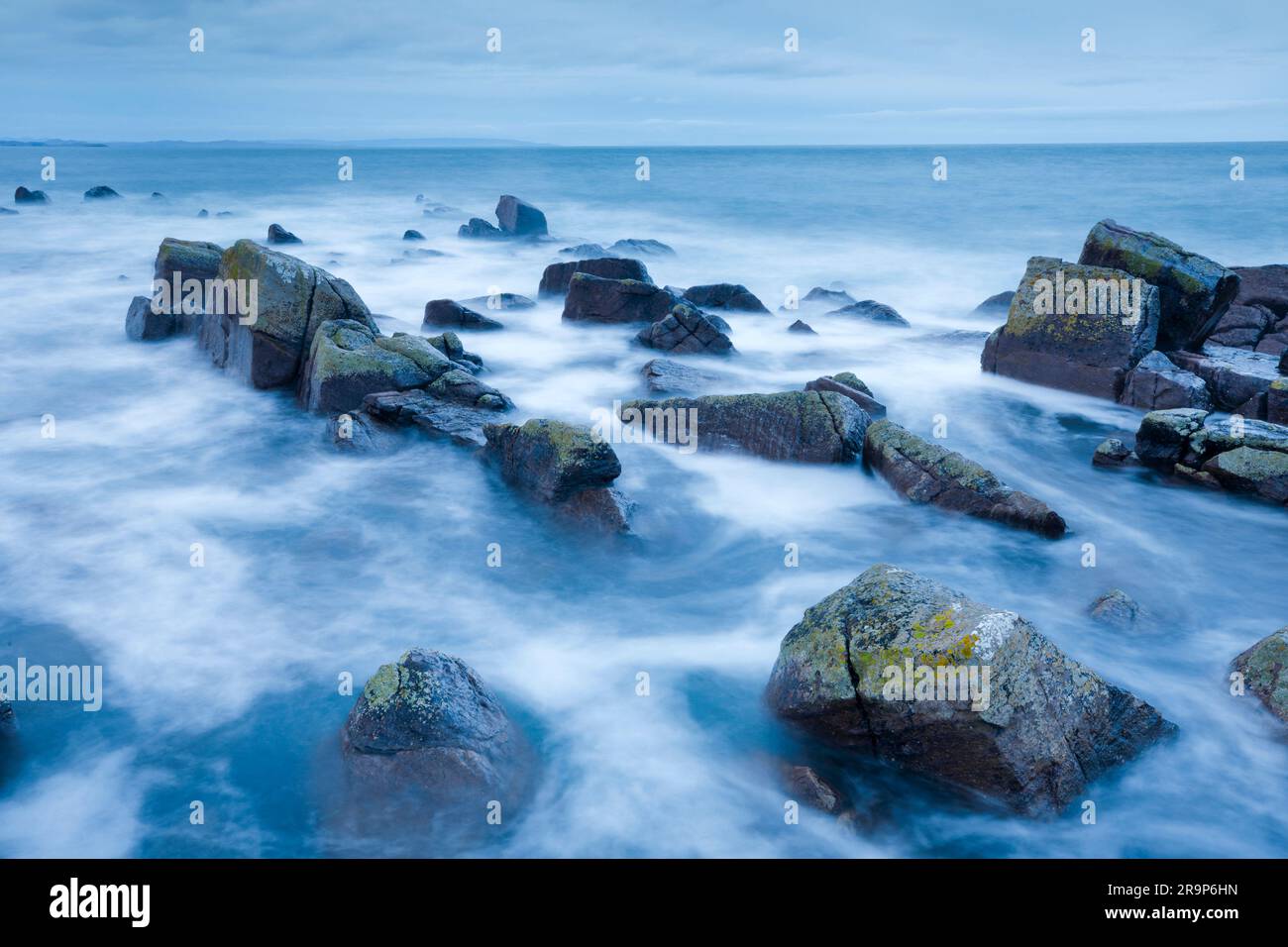 Stormy sea and rocky coast in the morning dawn. At Reiff on the west ...