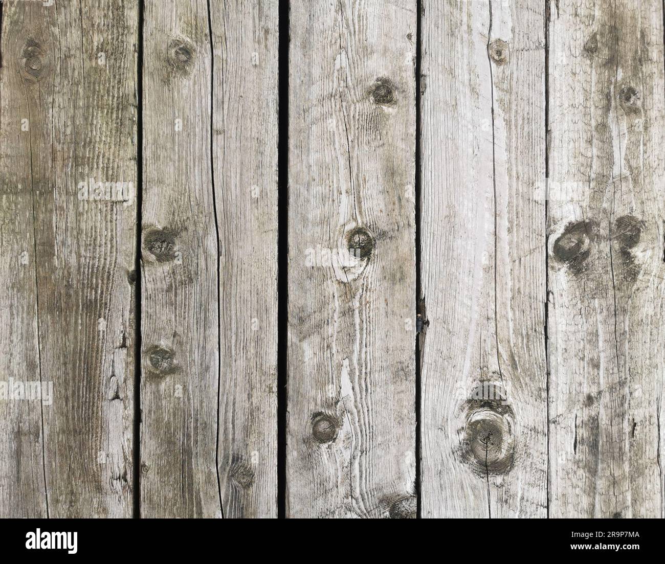 A wooden plank background, showing signs of wear and tear, with rusting ...
