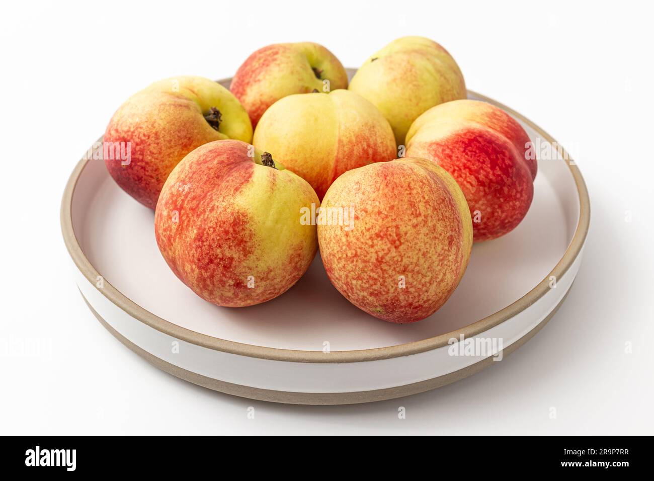 white peaches without hairs on a white background Stock Photo - Alamy