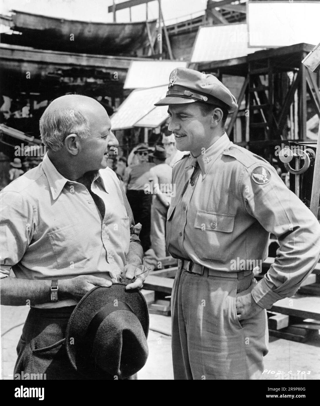 CECIL B. DEMILLE on set candid with Set Visitor ROBERT PRESTON in his ...
