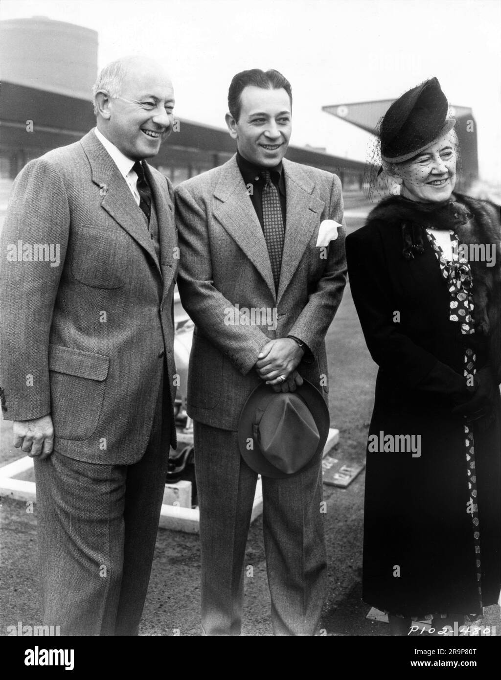 CECIL B. DeMILLE with his wife CONSTANCE ADAMS DeMILLE and GEORGE RAFT ...