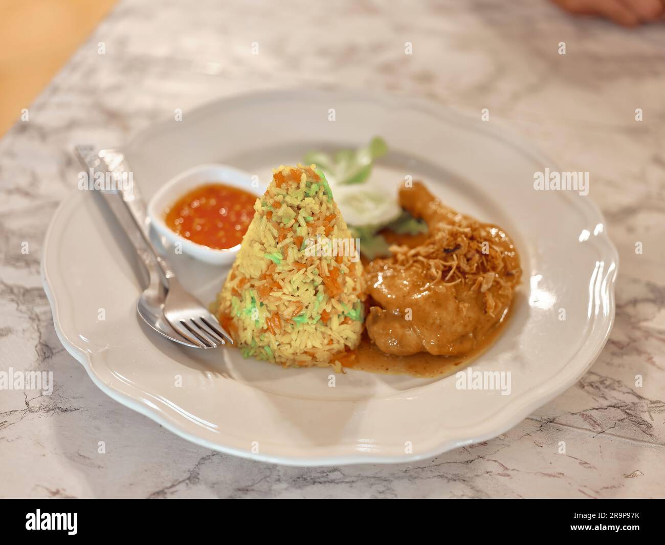 Muslim yellow rice with chicken - Muslim food style Stock Photo - Alamy