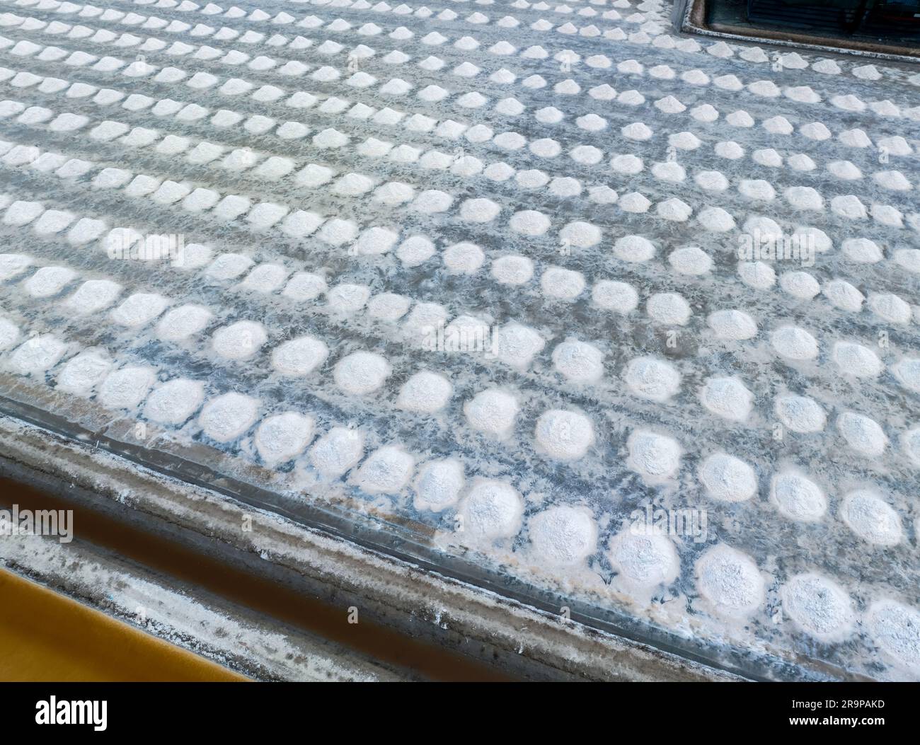 Aerial top view sea salt farm. Pile of brine salt. Raw material of salt ...