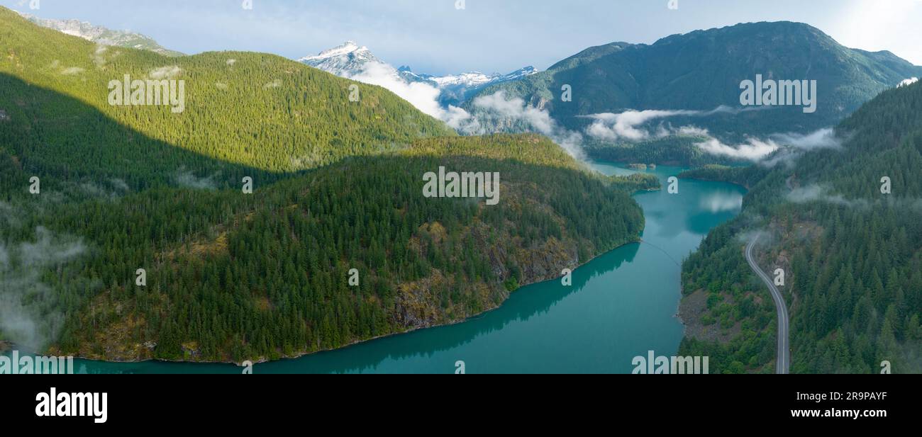 Clouds drift across the rugged landscape in North Cascades National ...
