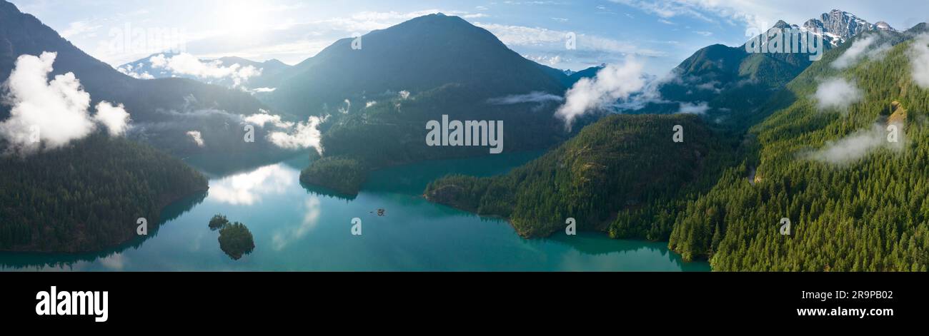 Clouds drift across the rugged landscape in North Cascades National ...