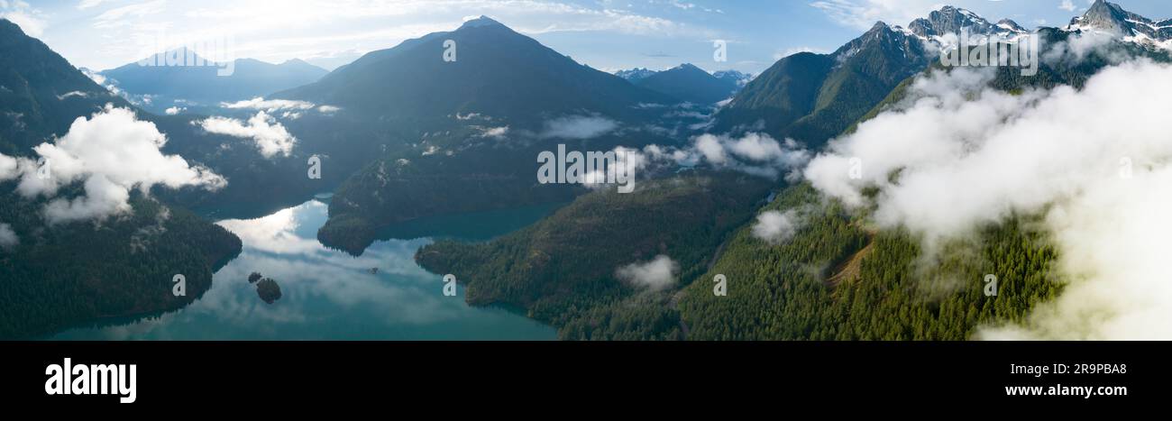Clouds drift across the rugged landscape in North Cascades National ...