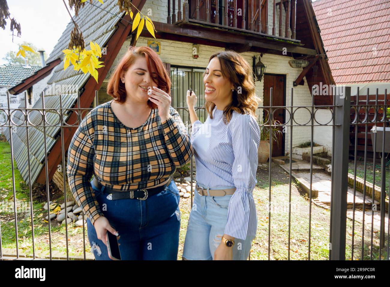 two latin women of argentinian ethnicity enjoying, talking and smiling ...