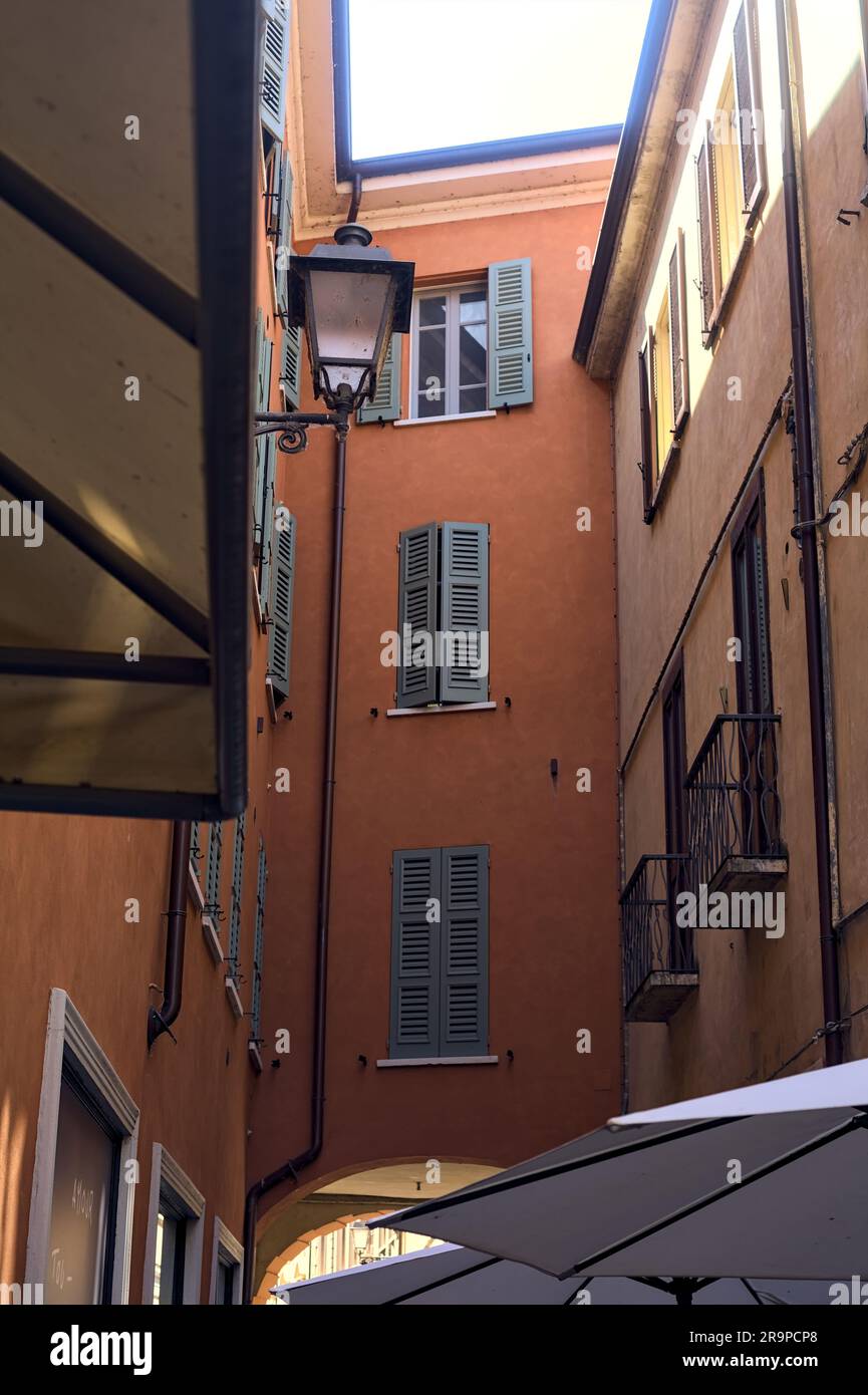 Facades of buildings in an alley at daytime in an italian town Stock ...