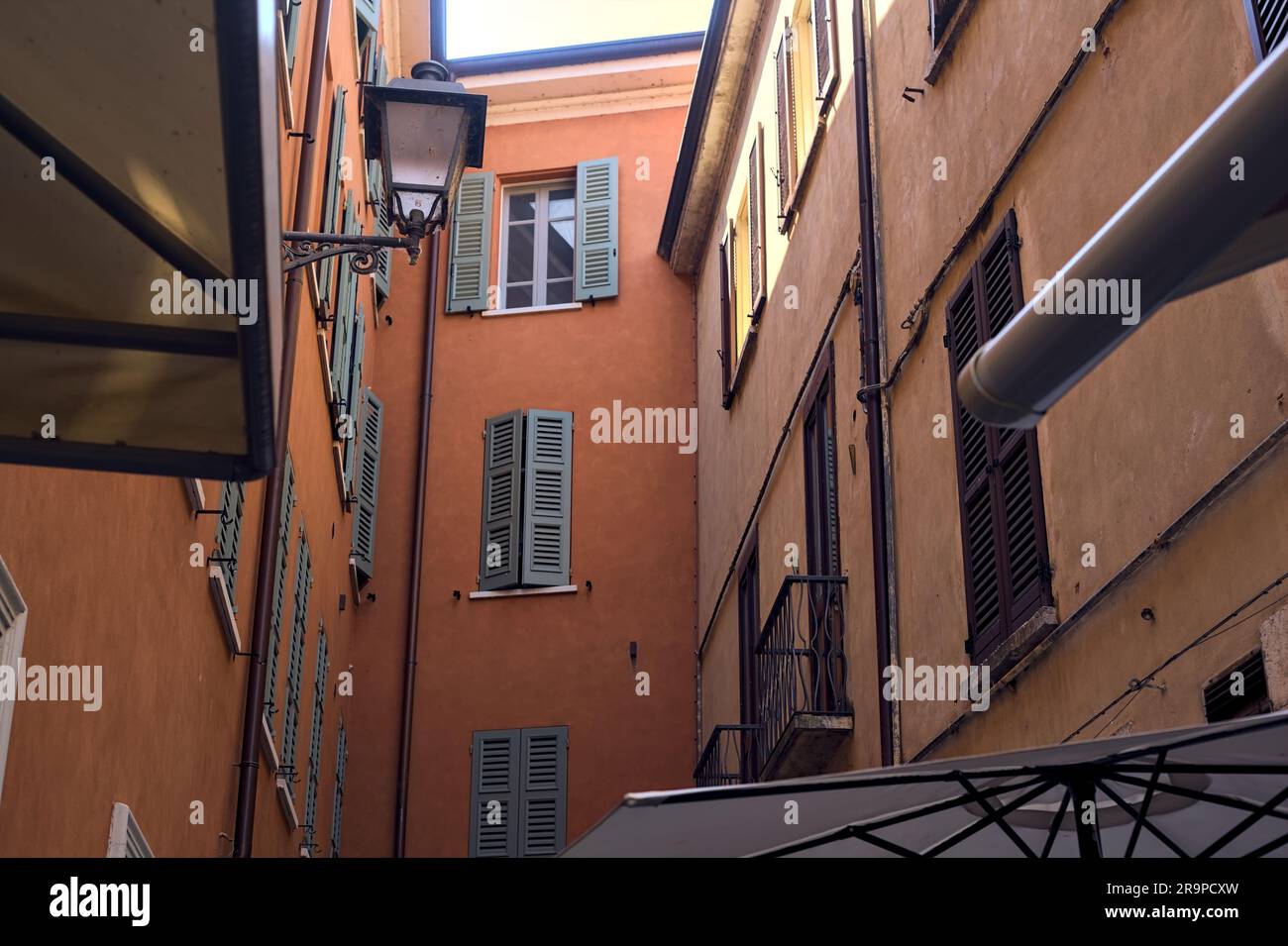 Facades of buildings in an alley at daytime in an italian town Stock ...