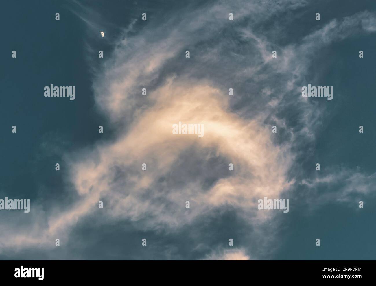 Early evening moon in a Florida sky Stock Photo - Alamy