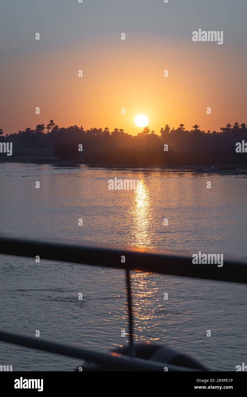 Seeing a sunset from a ship Stock Photo - Alamy