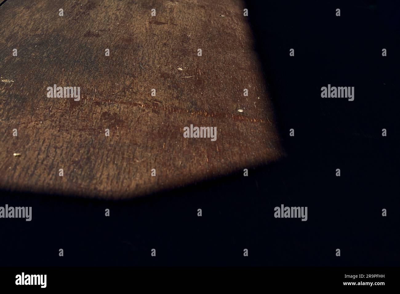 Wooden plank with a metallic border lit by the sun seen up close Stock ...