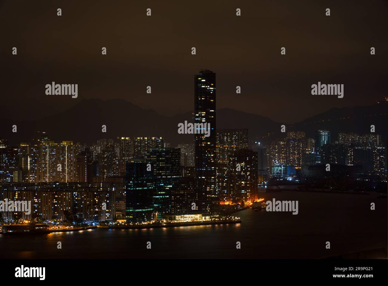 Night view of dense high-rise buildings in Hong Kong Island at night ...