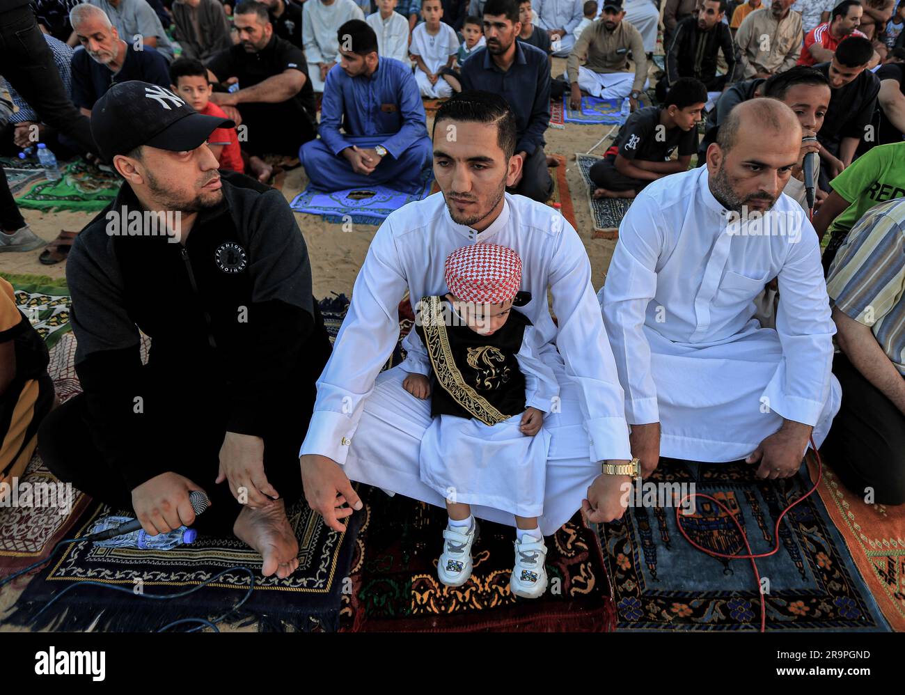 Gaza, Palestine. 28th June, 2023. A Palestinian child sits with his ...