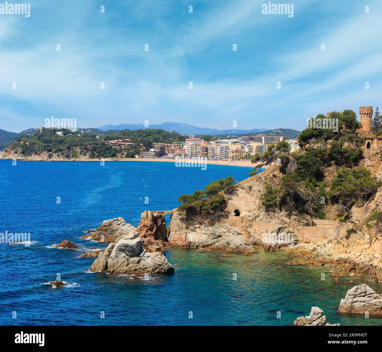 Summer sea rocky coast view with Castle of Sant Joan (Sa Caleta beach ...