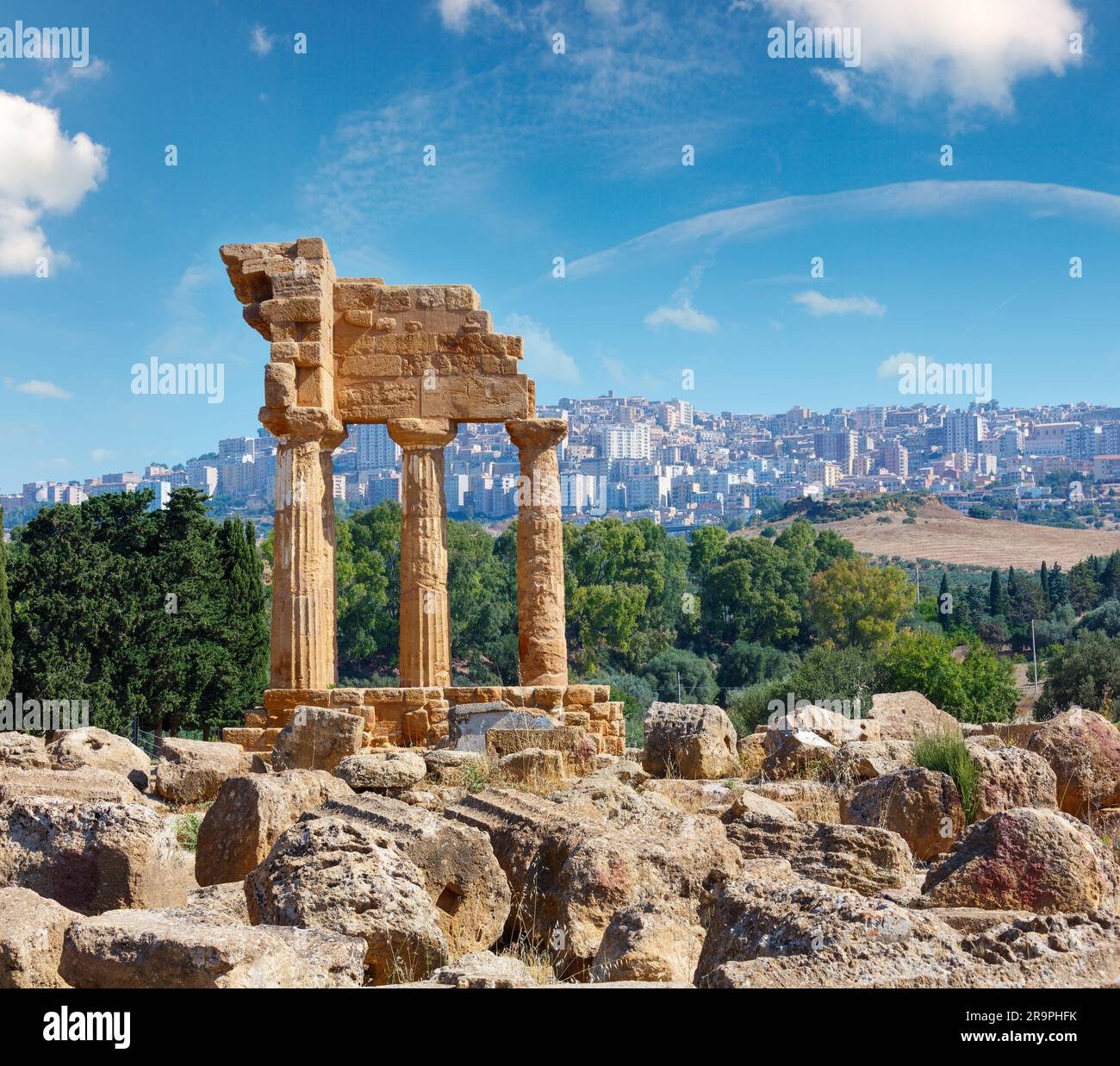 Temple of Dioscuri (Castor and Pollux) with Agrigento town in the ...