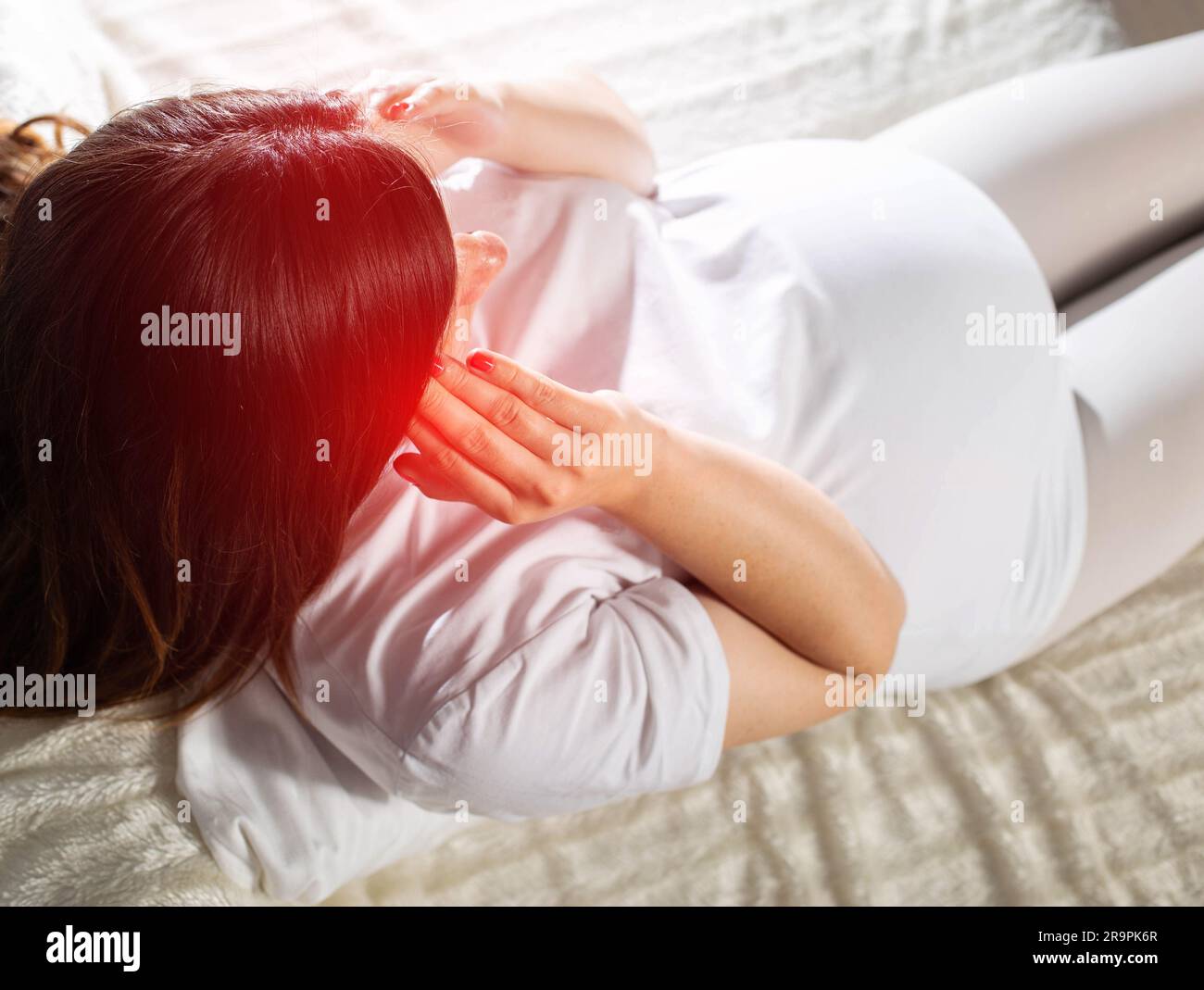 Headache and dizziness in a pregnant girl holding her head. Hormonal ...