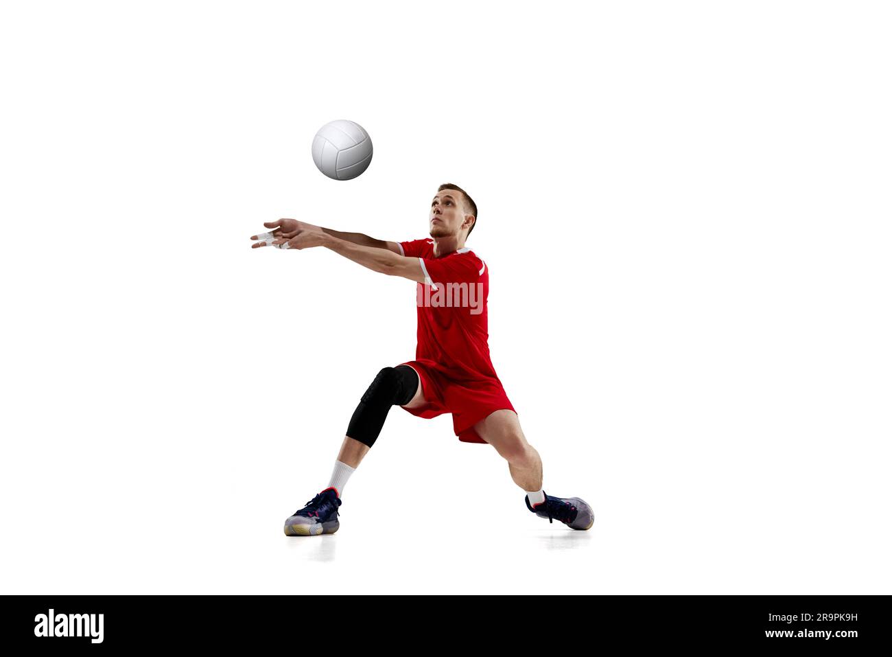 Serving ball. Young concentrated man, professional volleyball player in ...