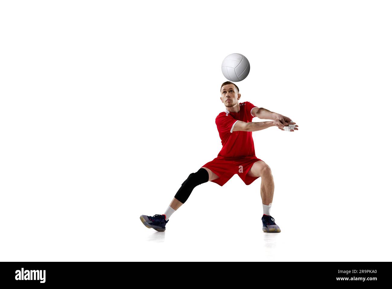 Serving ball. Young concentrated man, professional volleyball player in ...