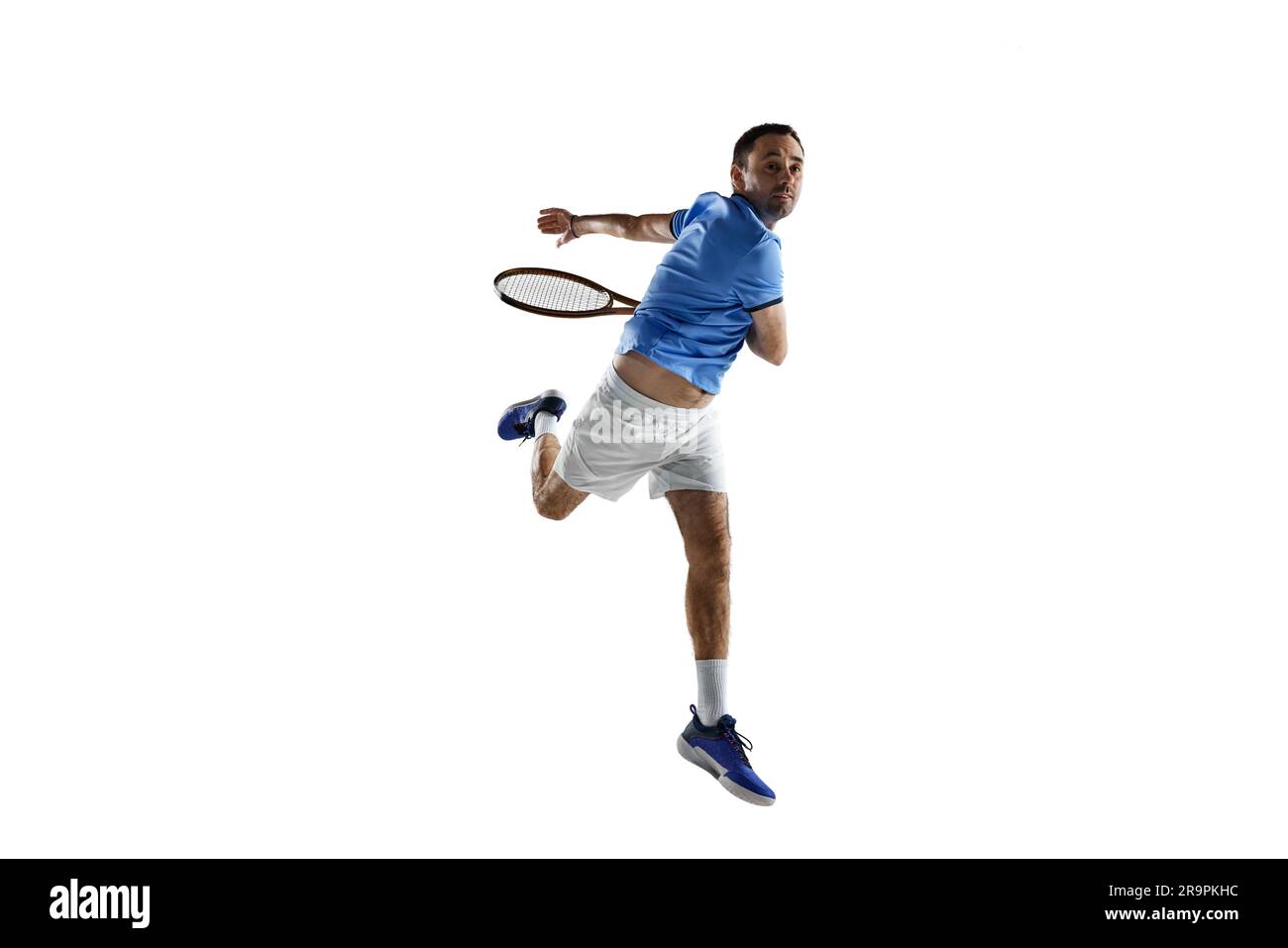 Dynamic image of concentrated man, professional tennis player in motion ...