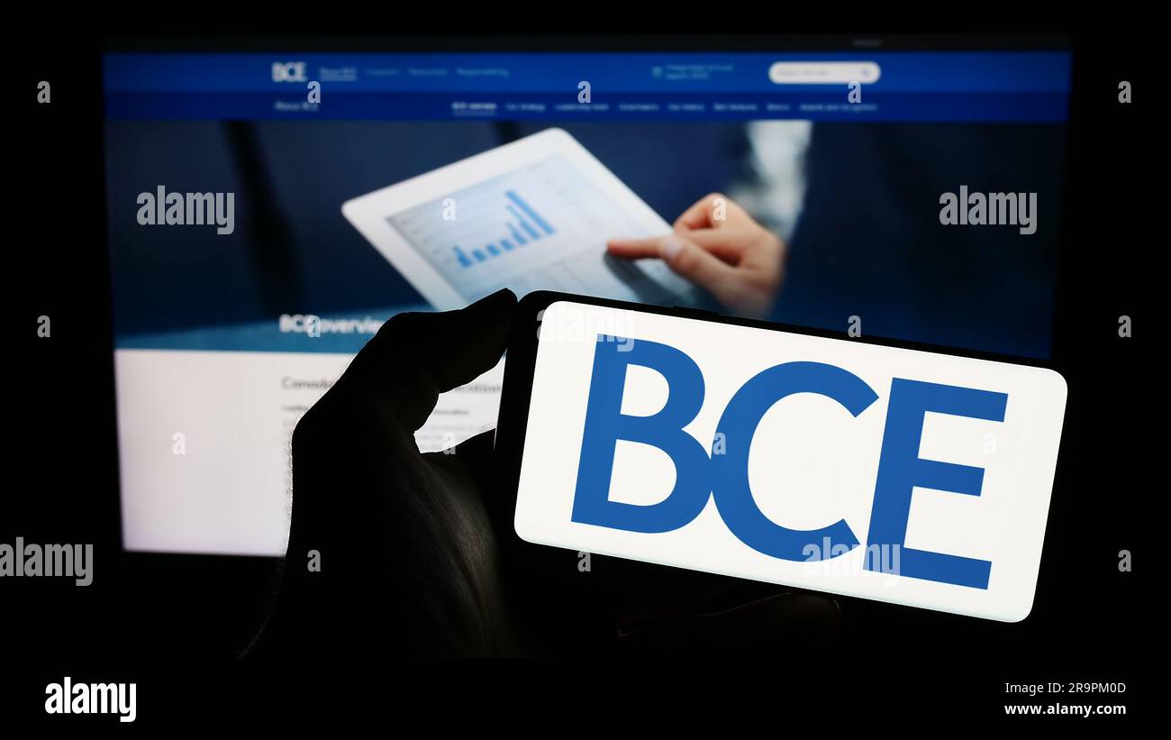 Person holding cellphone with logo of Canadian telecommunications ...