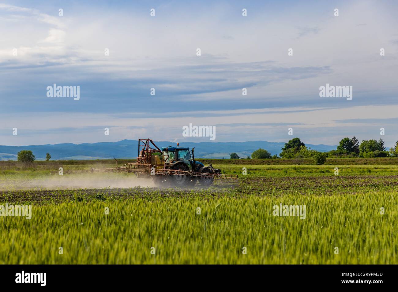 Tractor mounted sprayer spraying hi-res stock photography and images ...