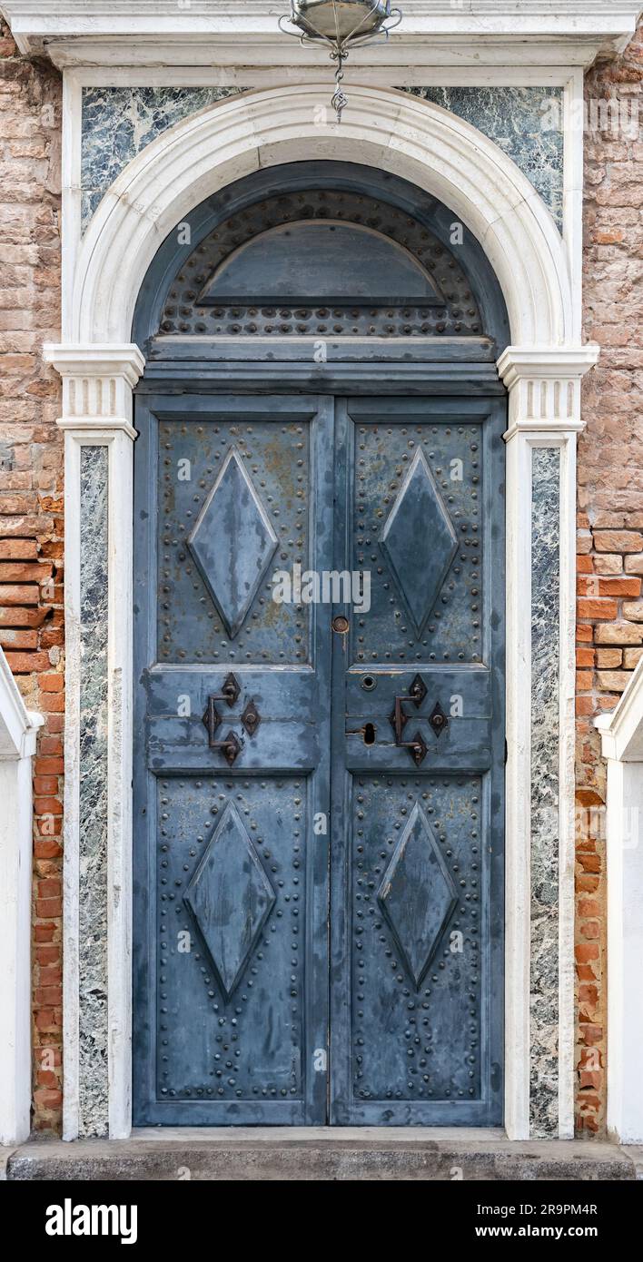 Old wooden entrance door. Arched door in Venice, Italy Stock Photo - Alamy
