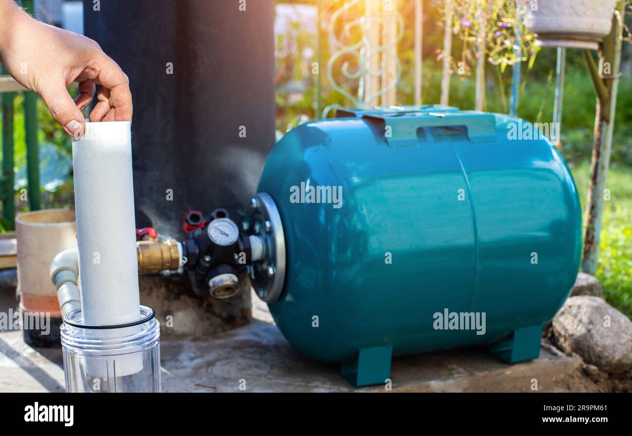 Water supply system from a well in a country house. New water filter ...