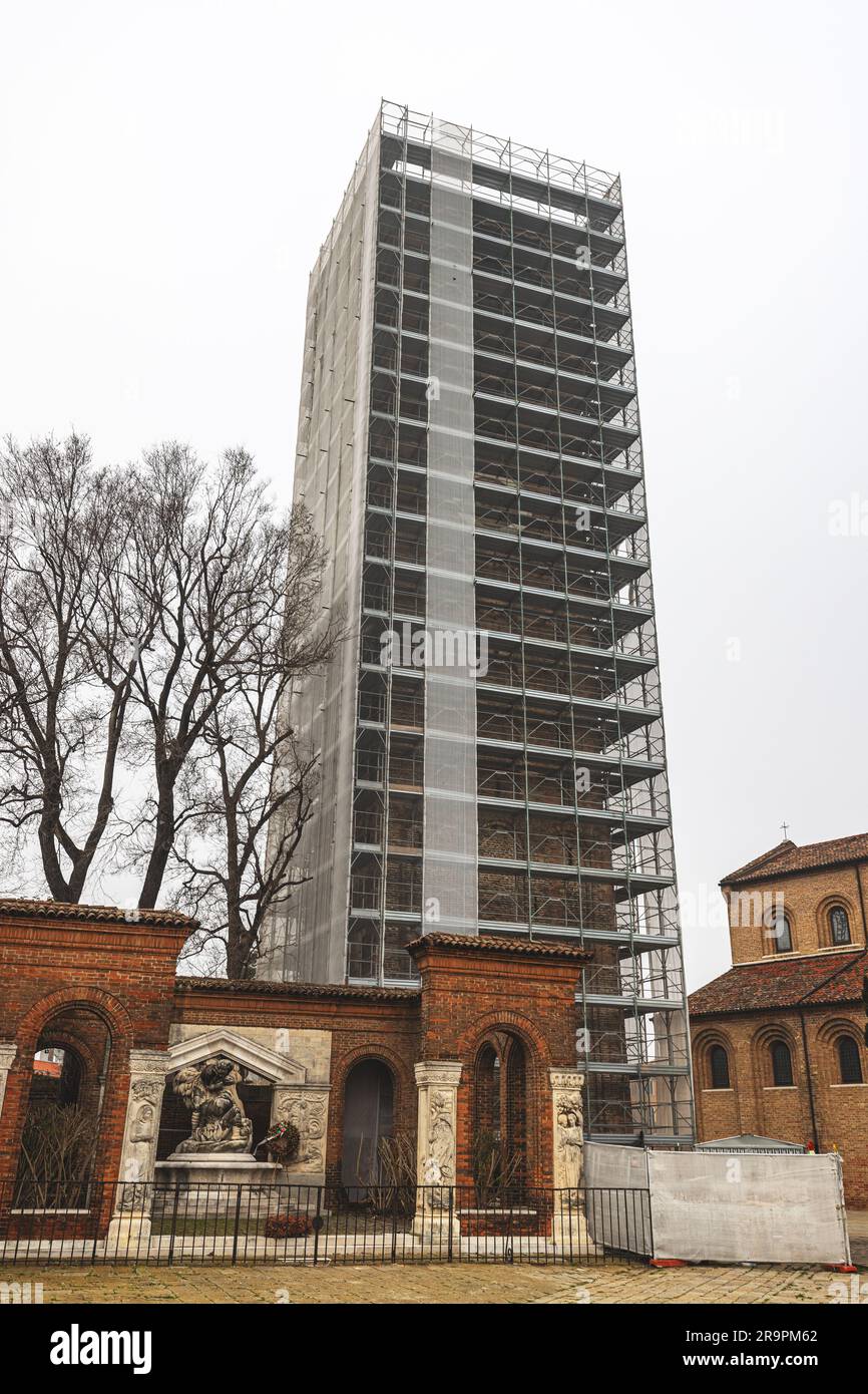 Scaffolding standing against the wall of tall building in Murano island ...